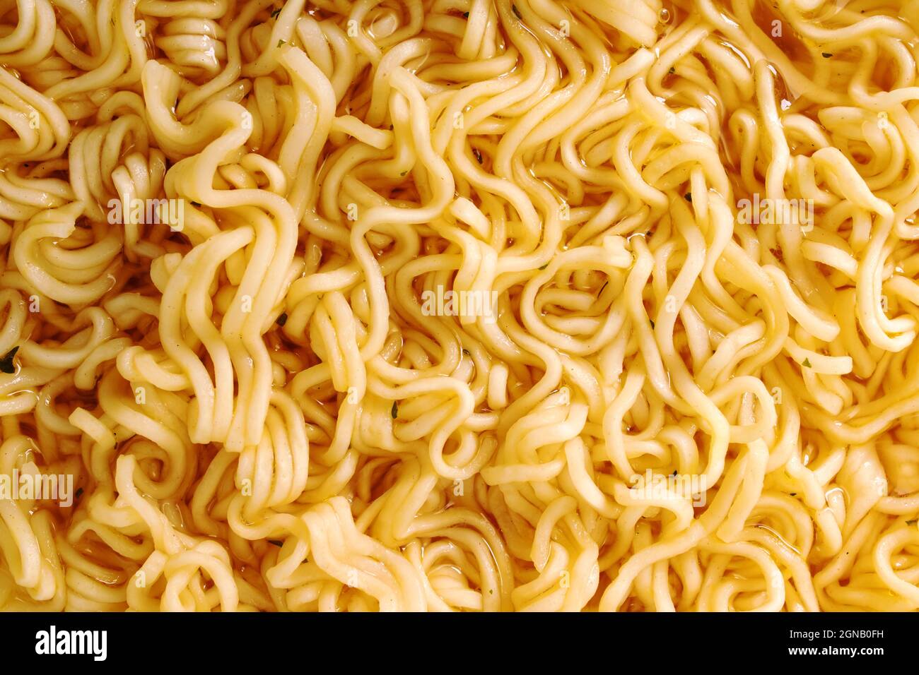 Yellow egg noodles close up, background or texture Stock Photo - Alamy