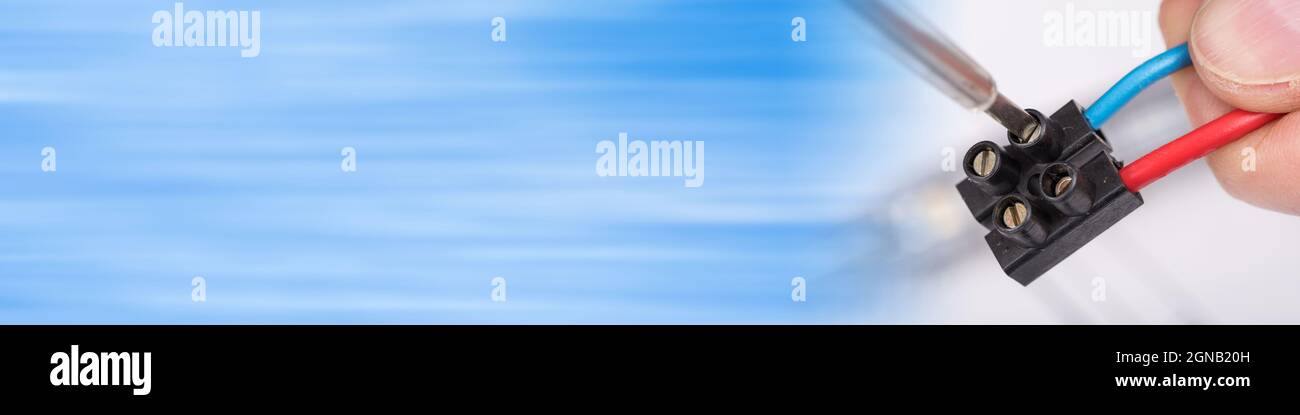 Clamping a wire in a connector, closeup Stock Photo - Alamy