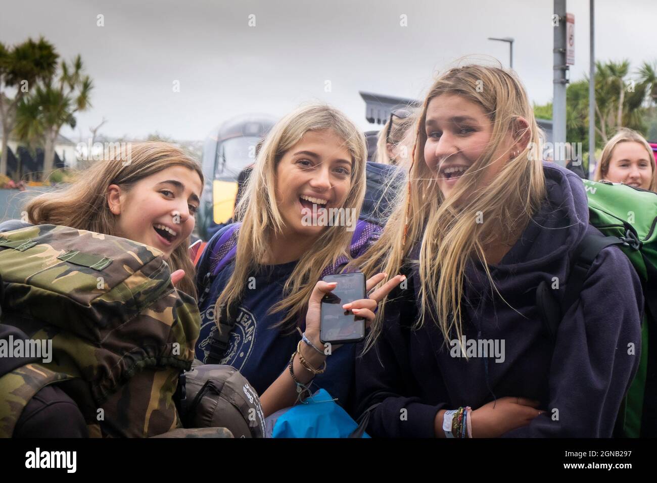 A group of excited young girls arriving at Newquay Train Station for ...