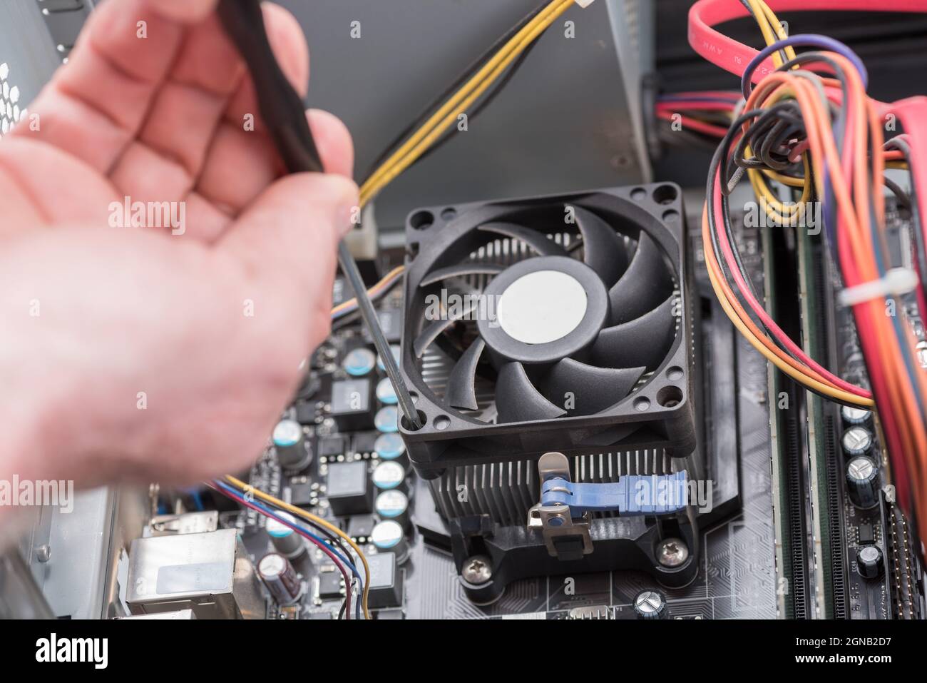 Hand repairing a computer Stock Photo - Alamy