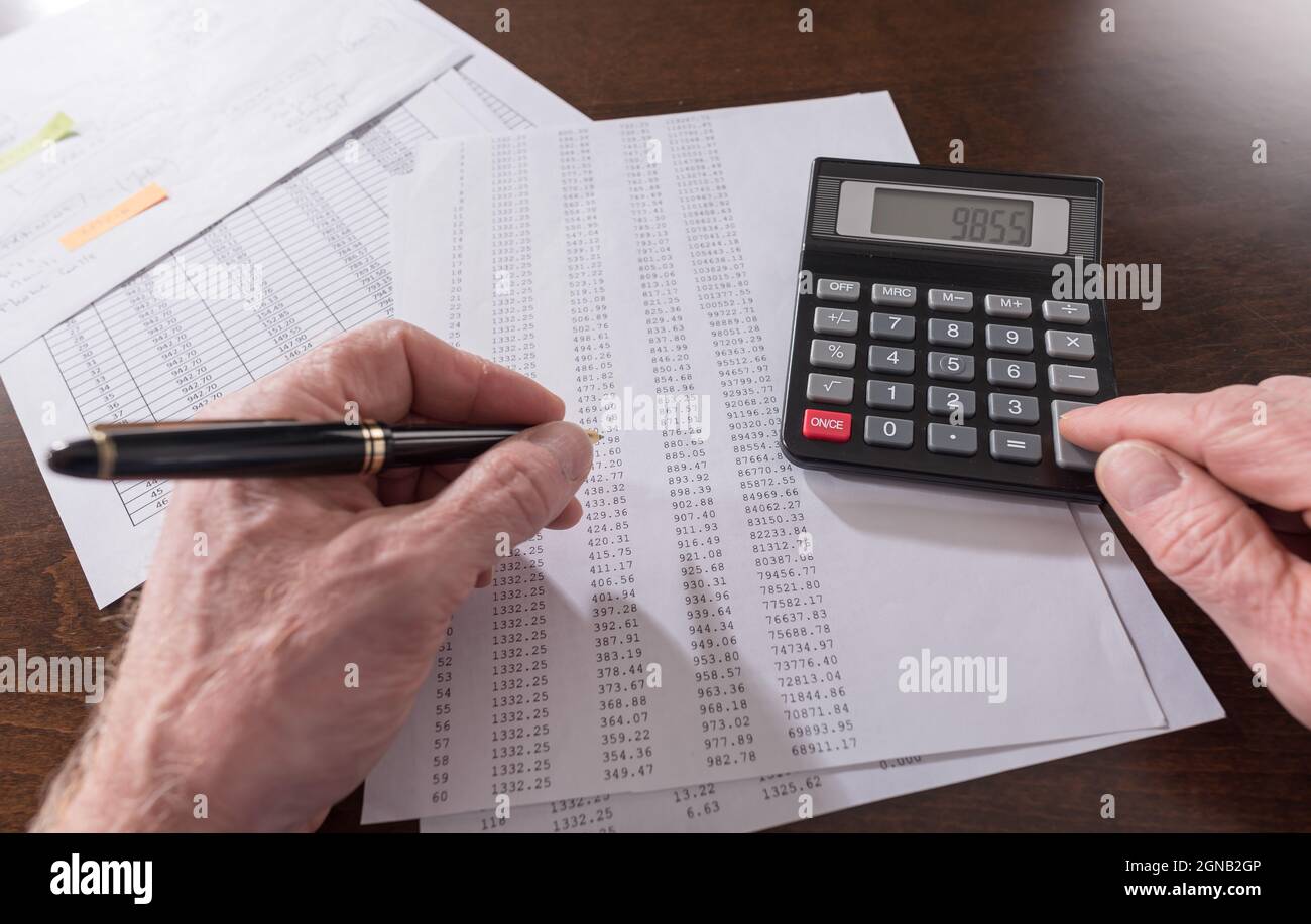 Male hand using calculator for analyze financial data Stock Photo - Alamy Male hand using calculator for analyze financial data Stock Photo - Alamy
