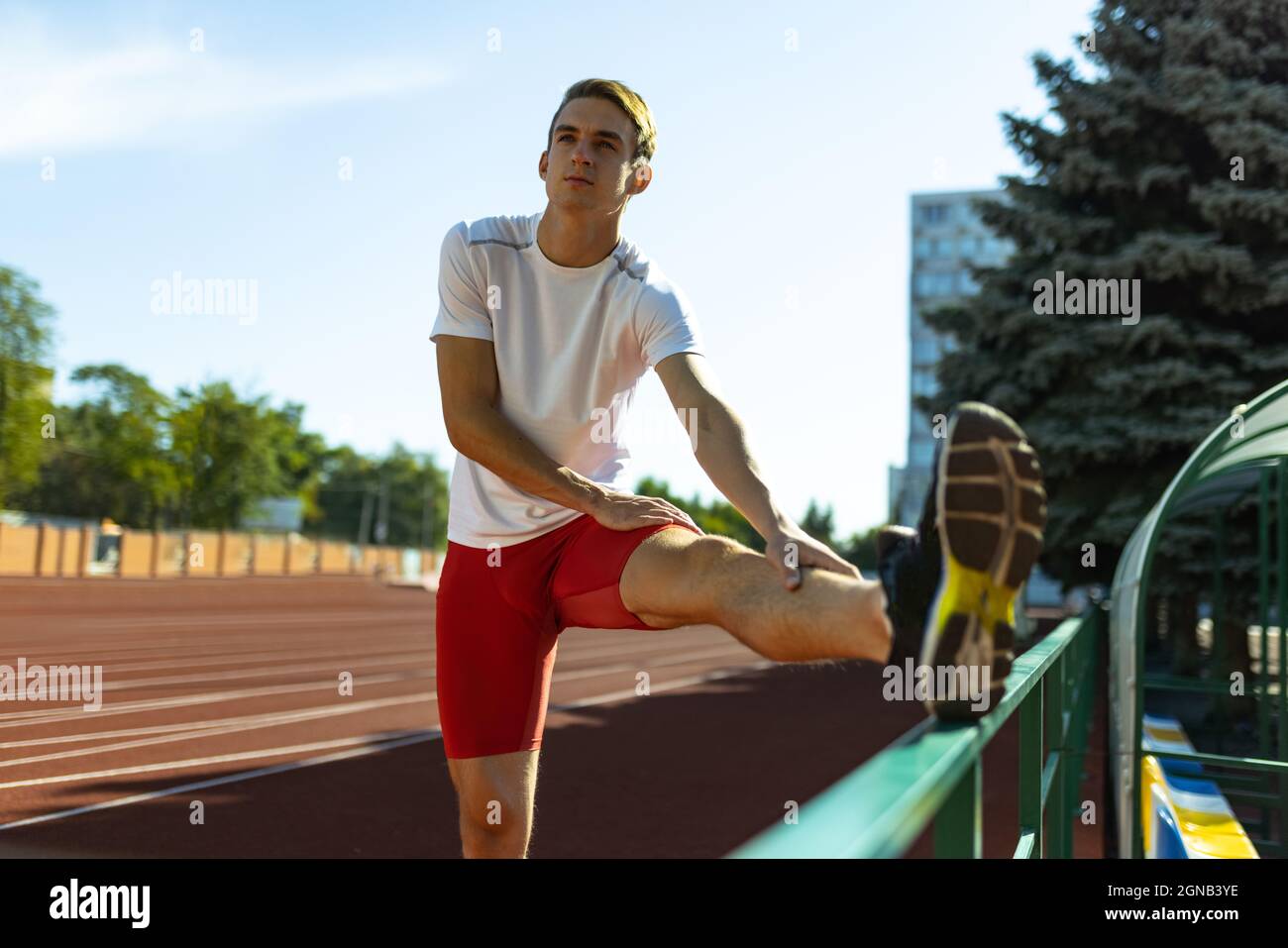 One young sportive man, male athlete, runner practicing alone before ...