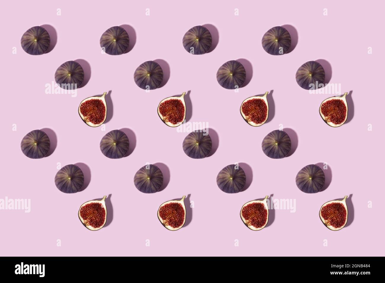 Figs pattern on a pastel pink background. View from above Stock Photo ...