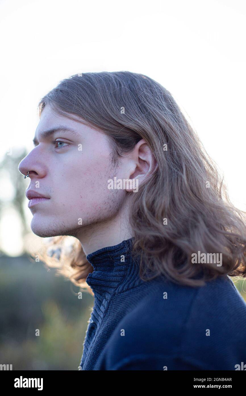 White european young man with blonde hair portrait Stock Photo - Alamy