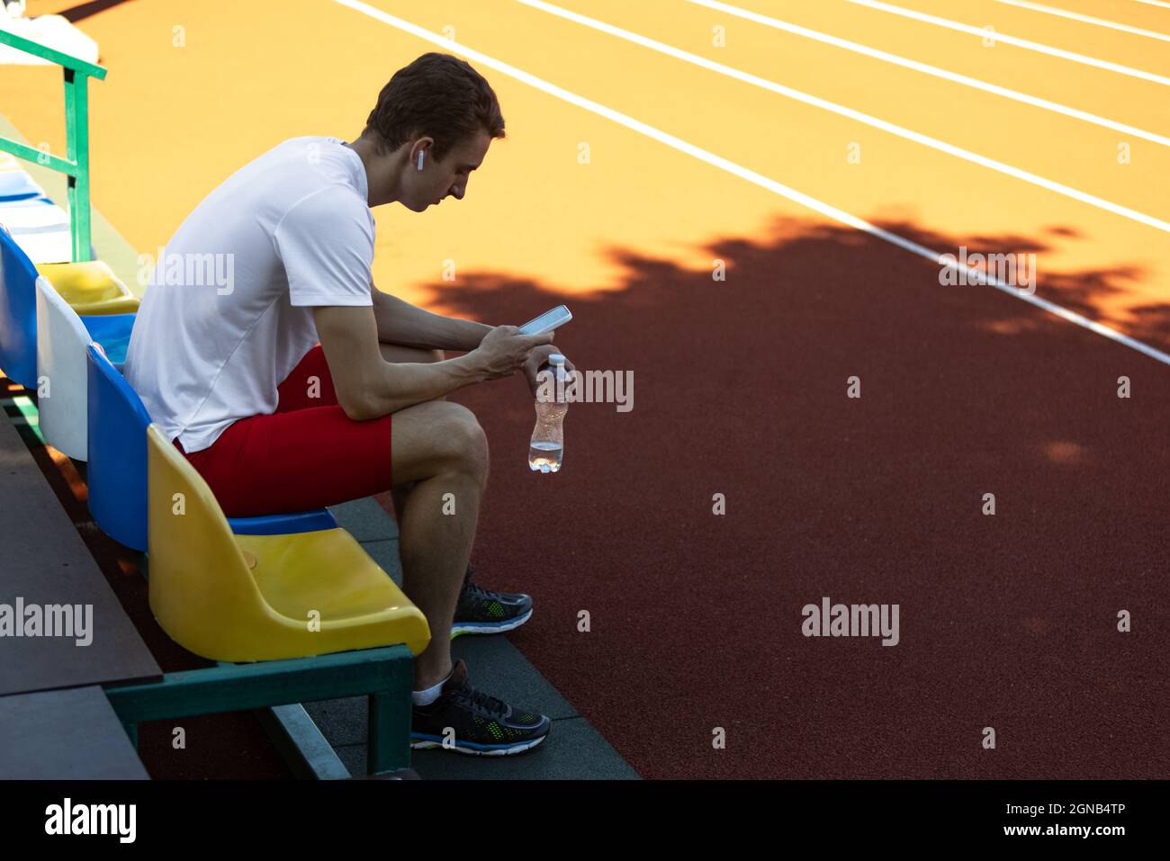 Portrait of young Caucasian man, male athlete, runner isolated at ...