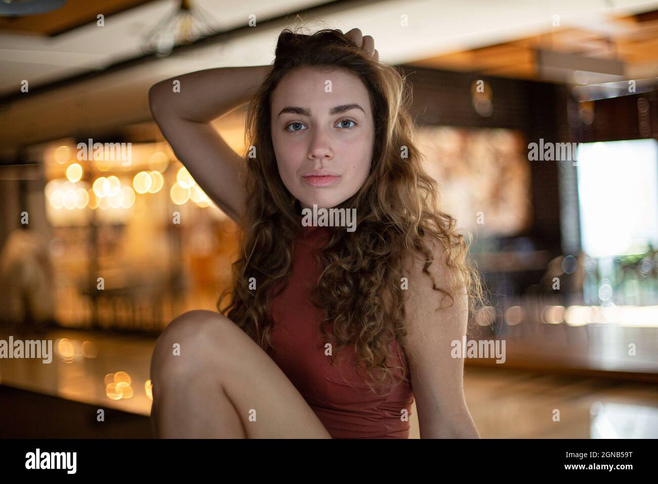 With hand behind head hi-res stock photography and images - Alamy