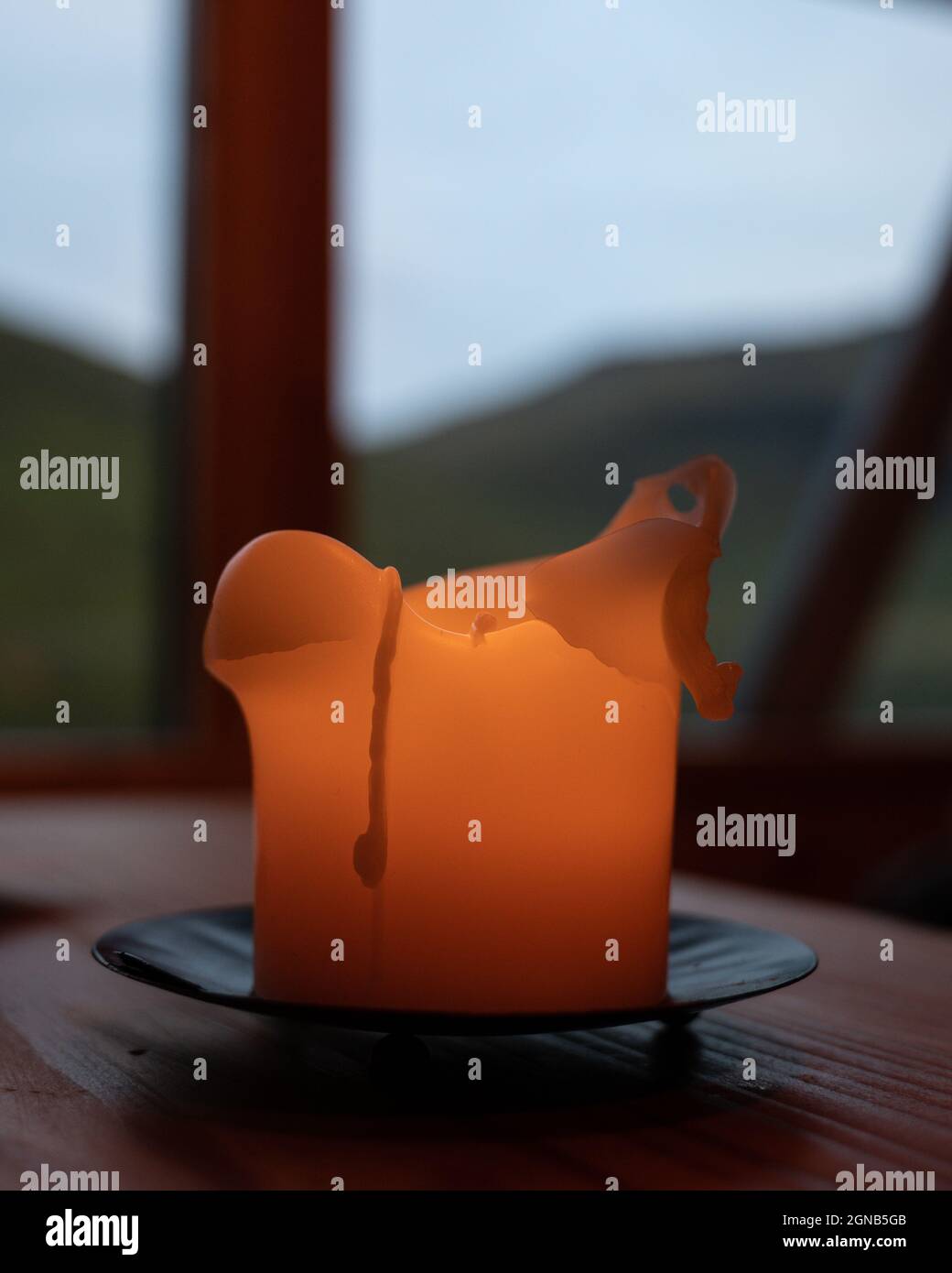 Warm candle lights close up, cozy interior Stock Photo - Alamy