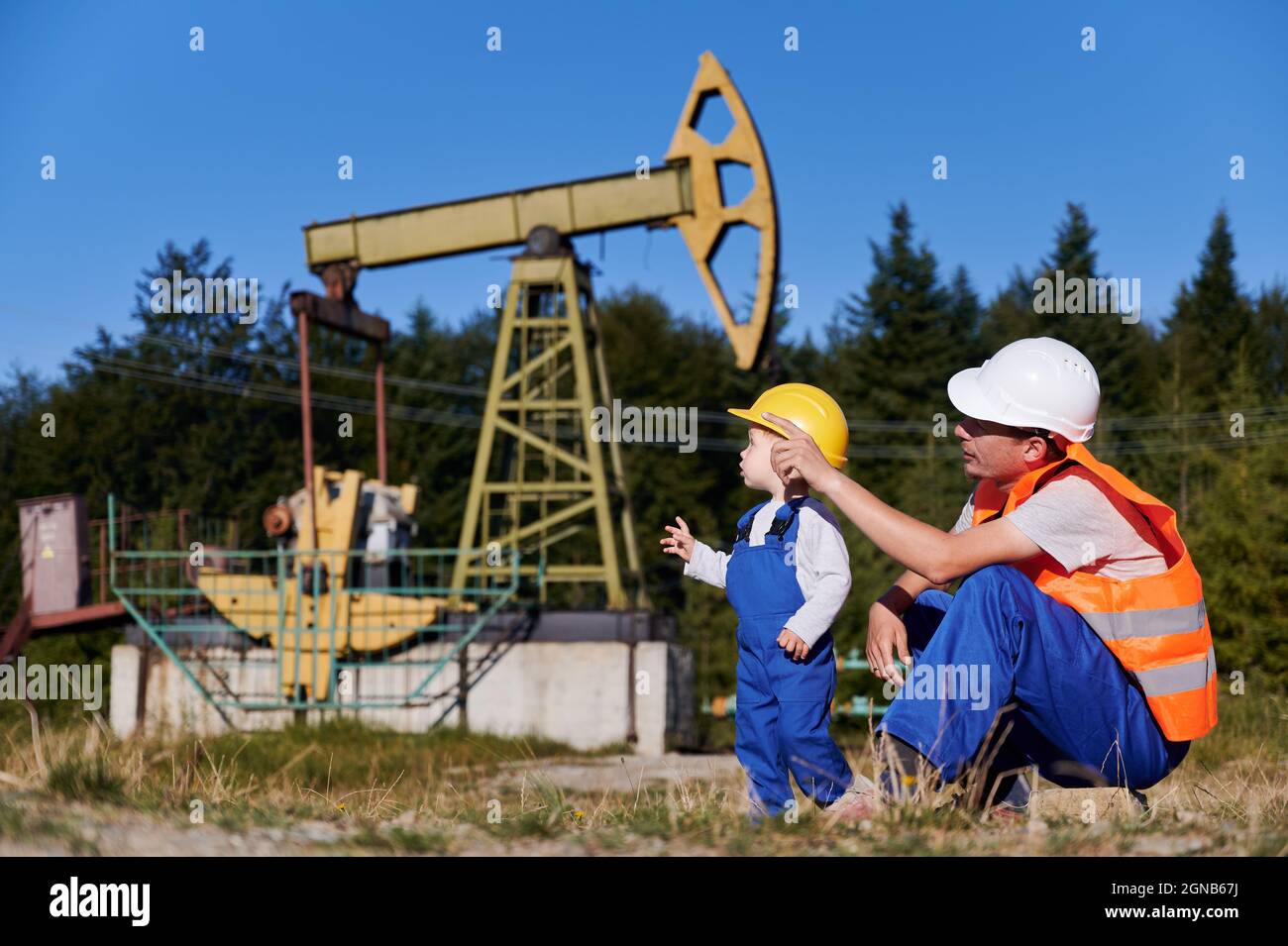 Professional Caucasian mechanic learning capable boy derrick ...