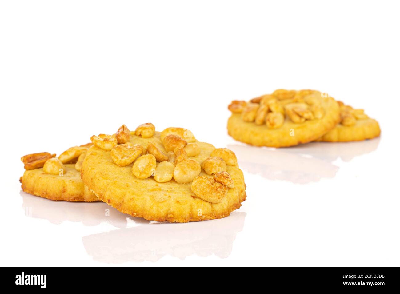 Group of four whole delicious cookie with peanuts on white background ...