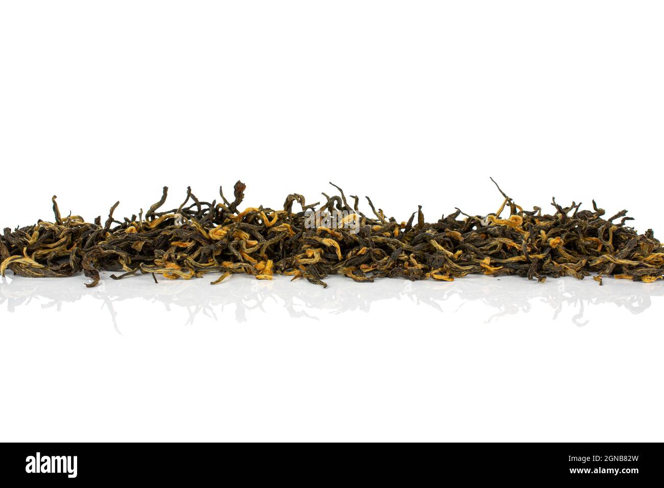 Dry black tea leaves in row isolated on white background Stock Photo ...