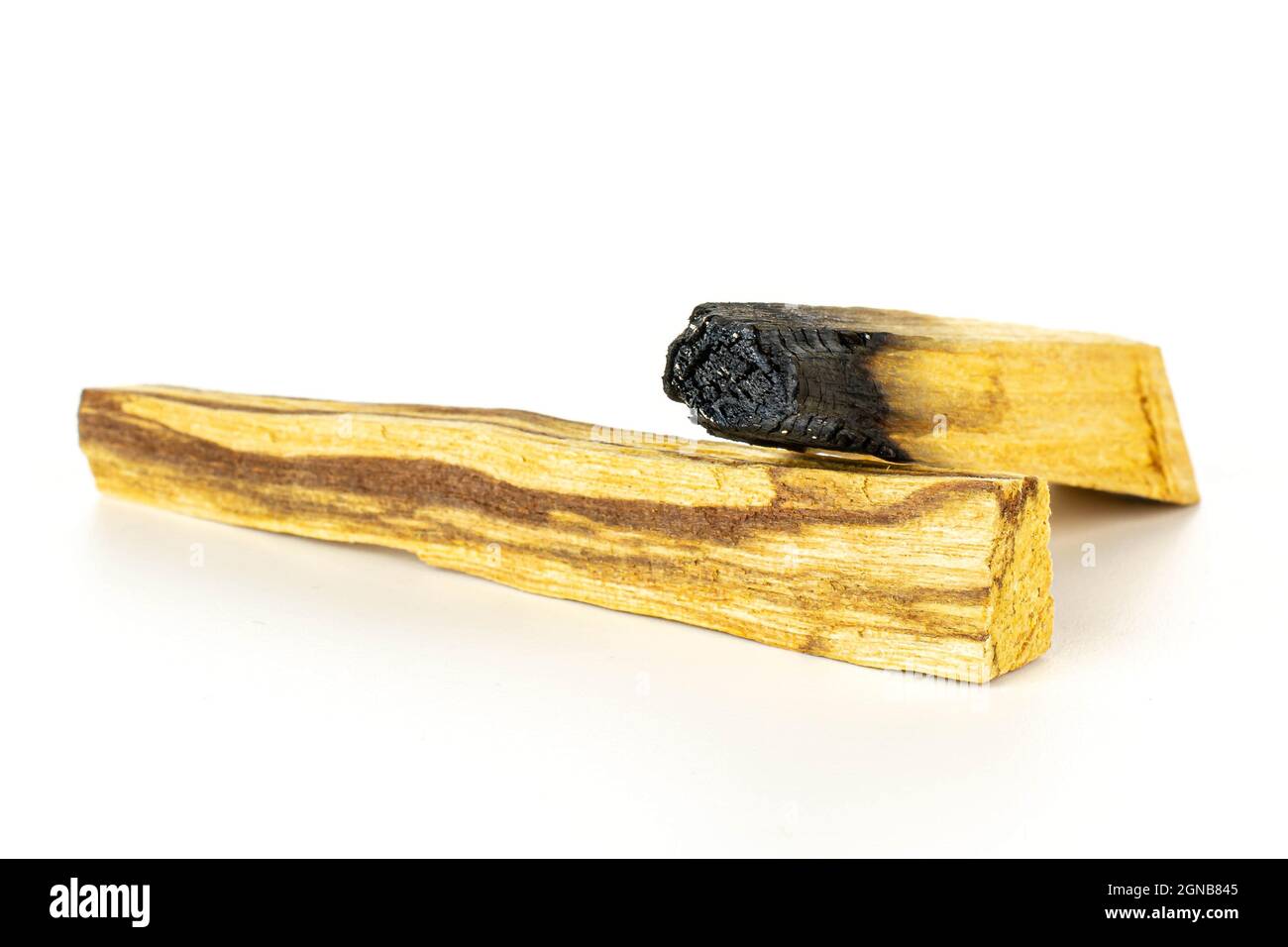 Group of two whole burnt palo santo stick isolated on white background ...