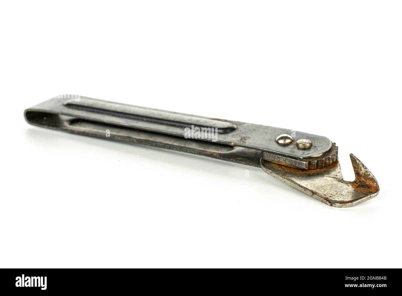 One old can opener isolated on white background Stock Photo - Alamy