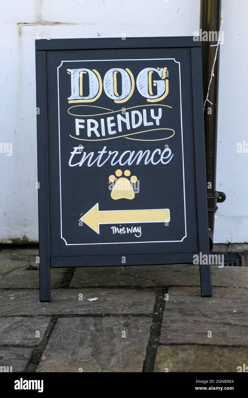 A sign outside a pub or public house saying 'dog friendly entrance ...