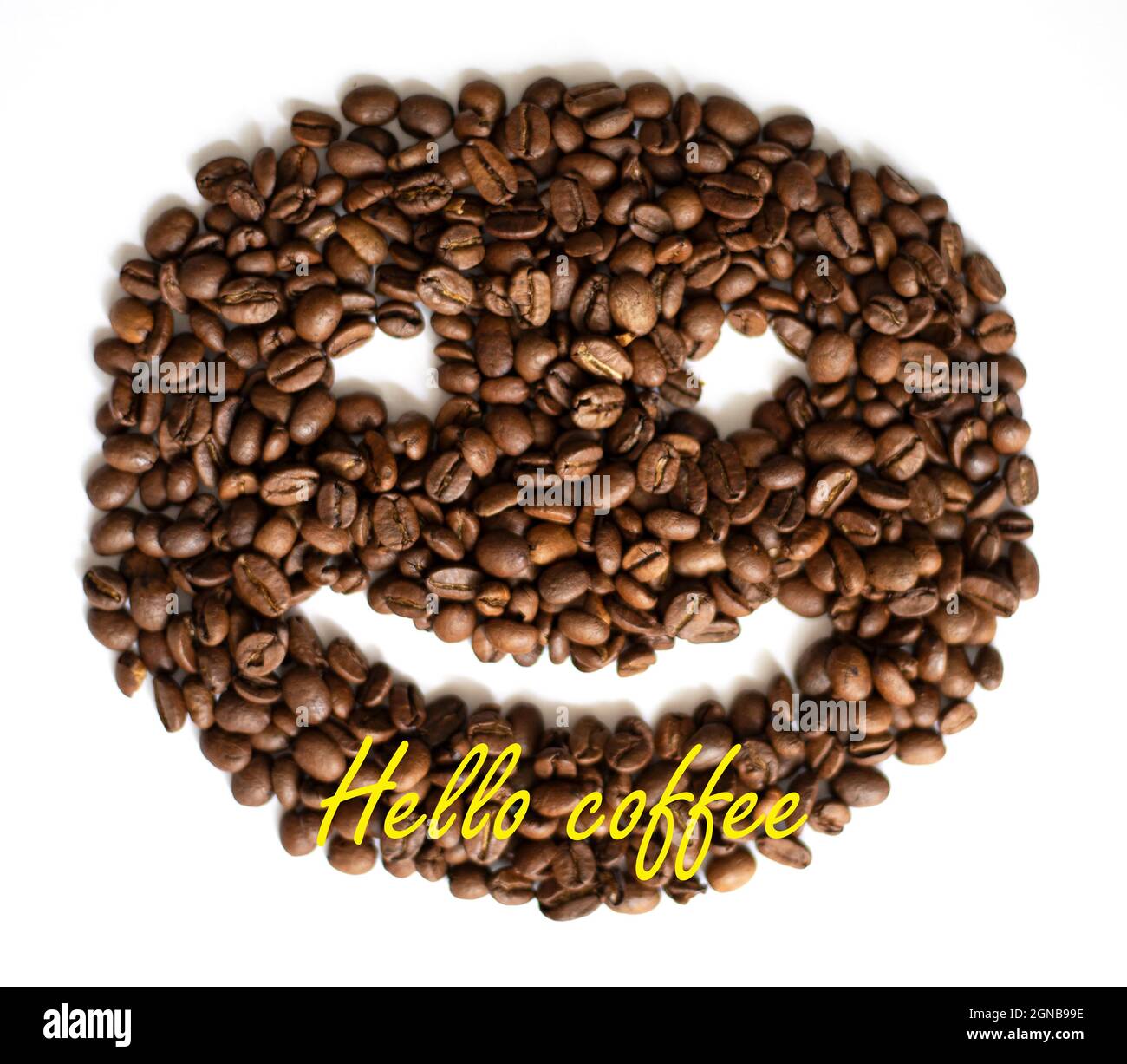 Hello coffee. Closeup of roasted coffee beans with smile on white ...