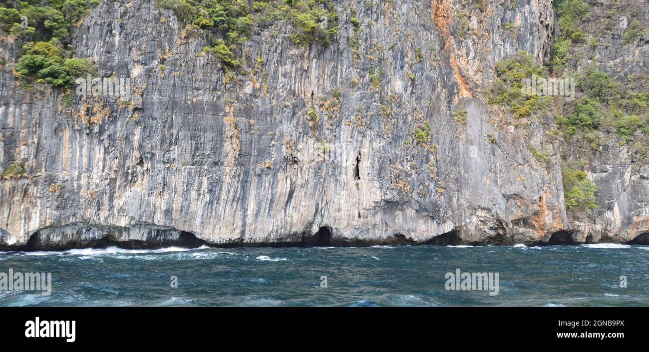 rock cut sea side landscape with greenery Stock Photo - Alamy