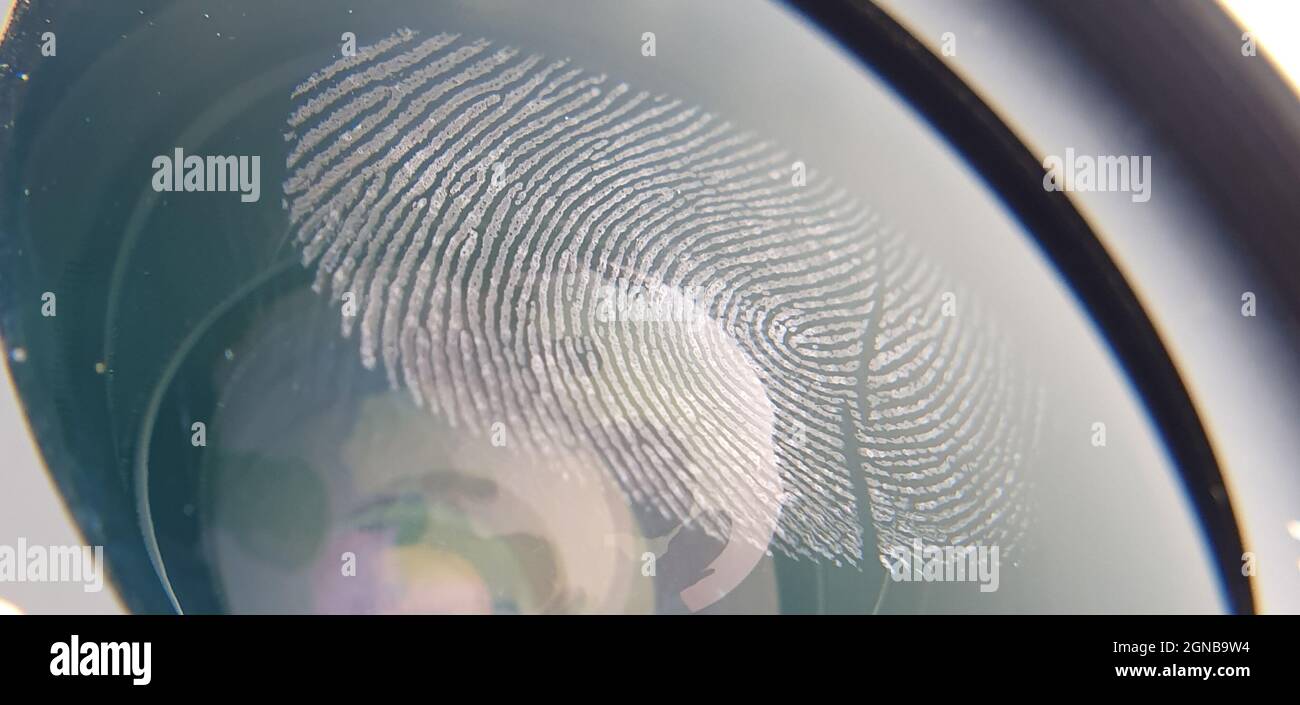 thumb fingerprint on camera lens Stock Photo - Alamy