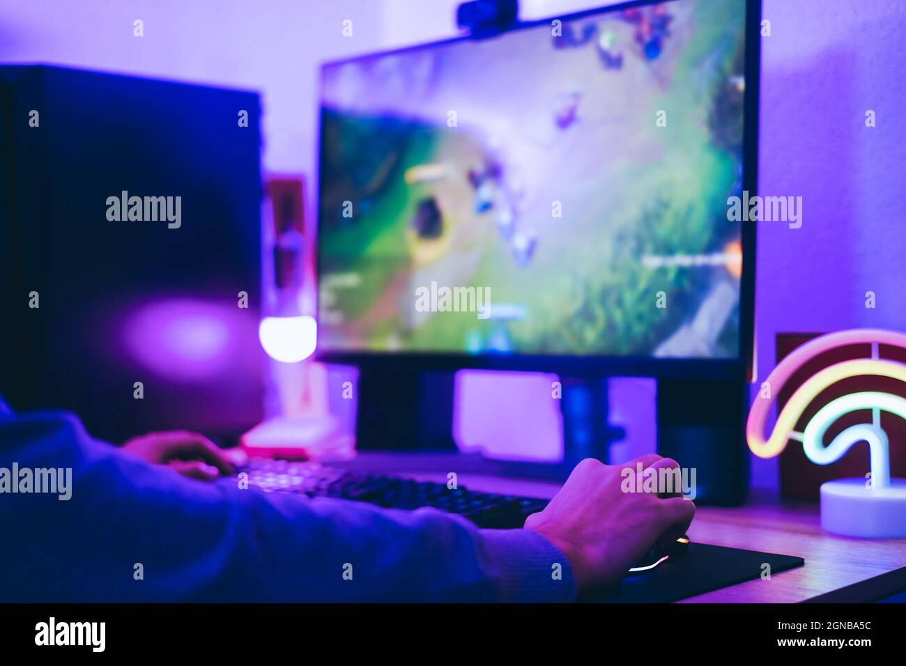 Streamer gamer playing strategy game online - Focus on right hand Stock ...