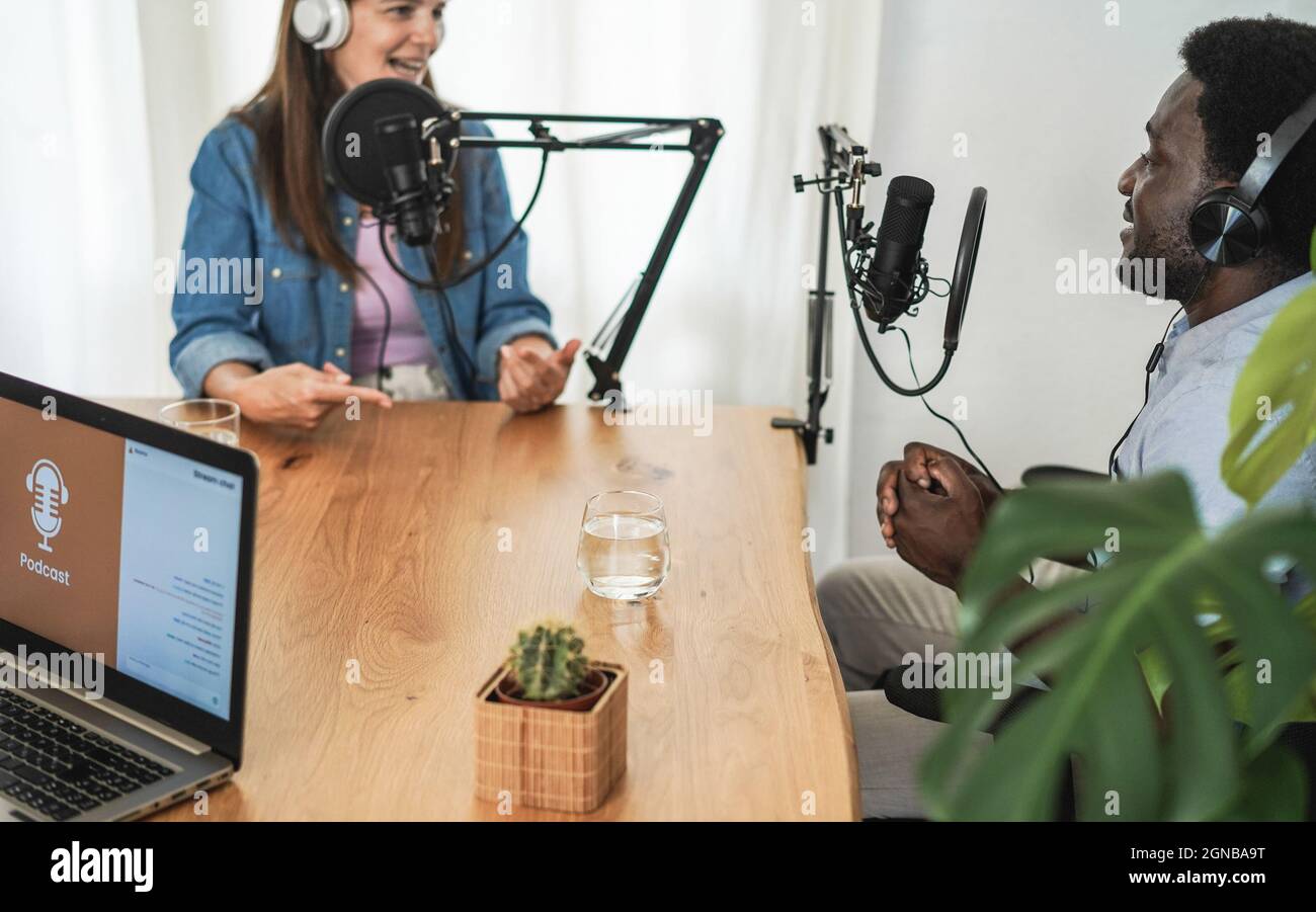 Hosts having podcast session together - Female speaker making an ...