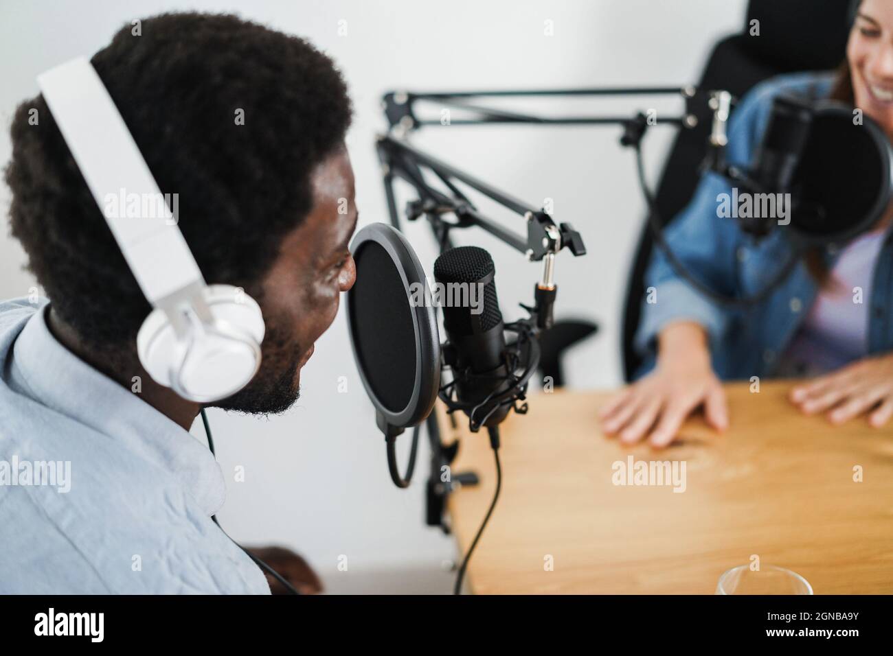 Hosts having podcast session together - Female speaker making an ...