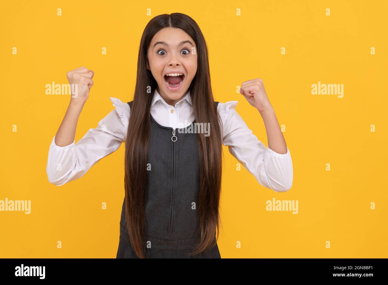 Happy teenage girl winner give winning gesture celebrating victory ...