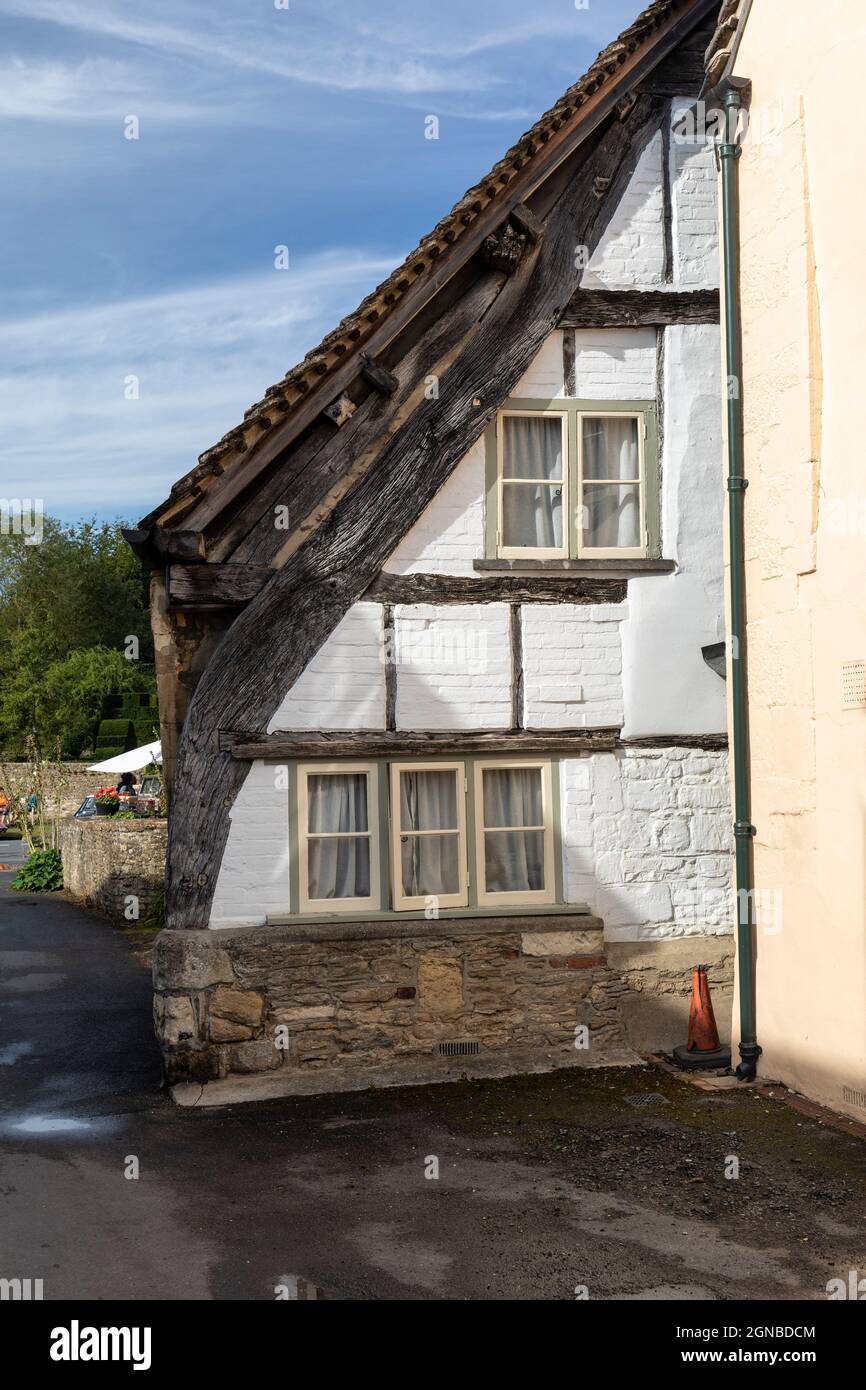 Side view of a picturesque timber framed cottage in Lacock village ...