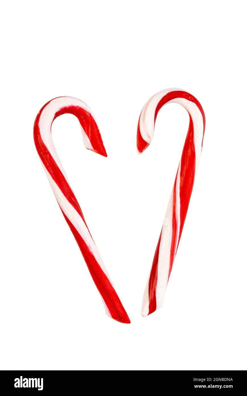 Two candy canes isolated on white background Stock Photo - Alamy