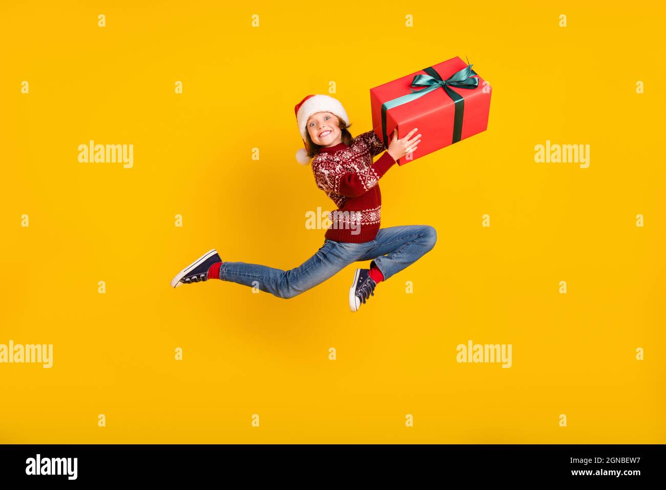 Full size photo of amazed cheerful little girl jump up hold hand ...