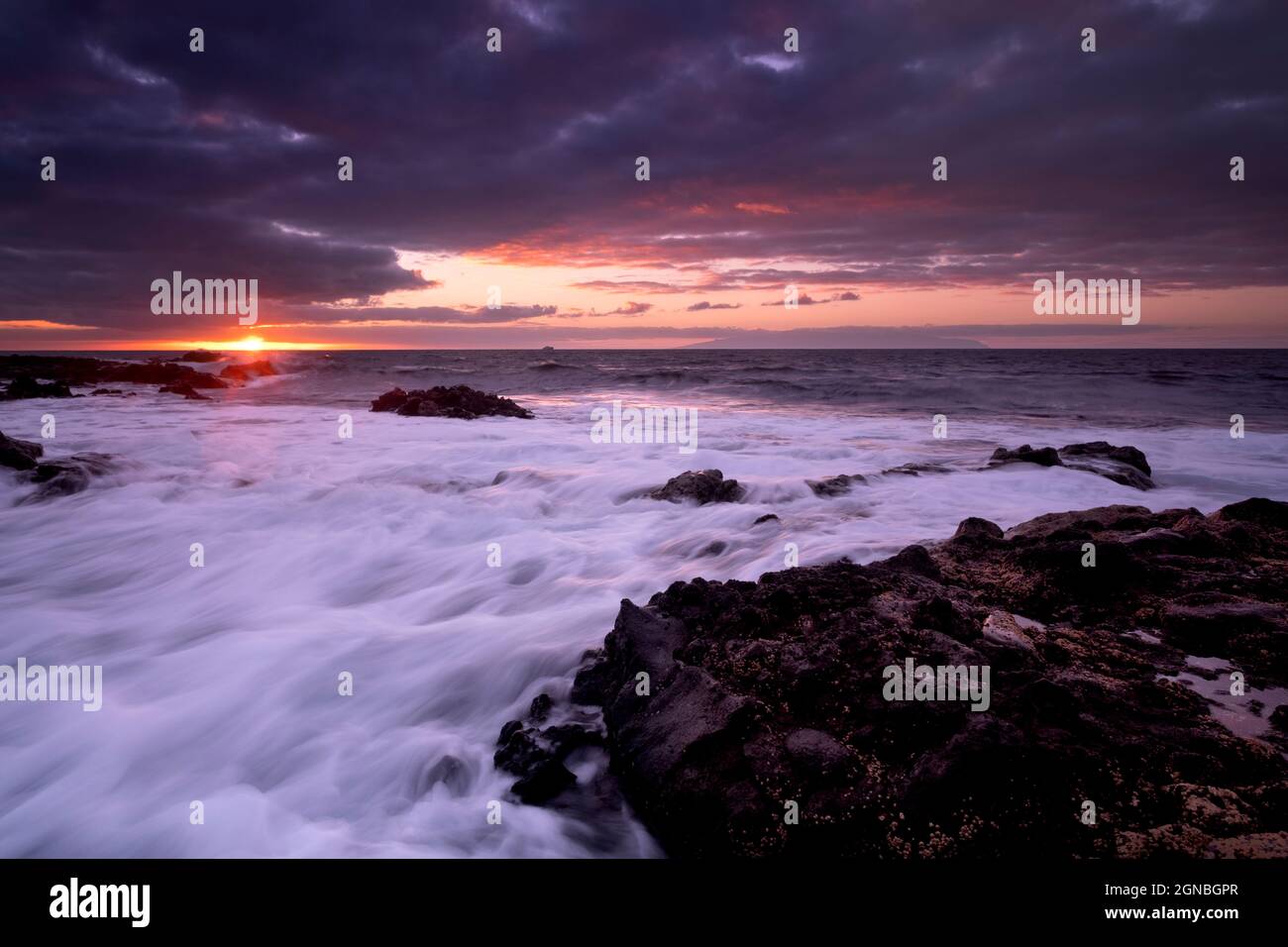 Sunset landscape at the beach with sea ocean and waves in background ...