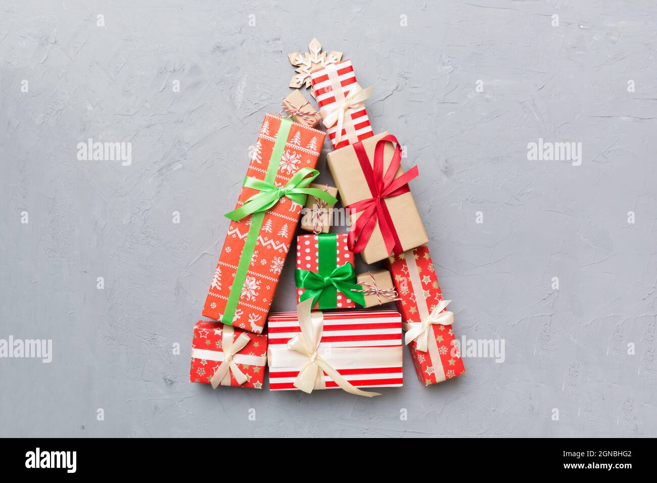 Christmas tree made of beautifuly wrapped presents on colored ...