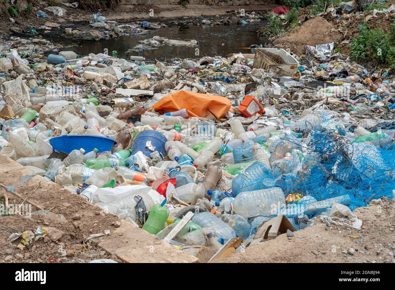 Plastic pollution blocks a stormwater drain in Grahamstown/Makhanda ...