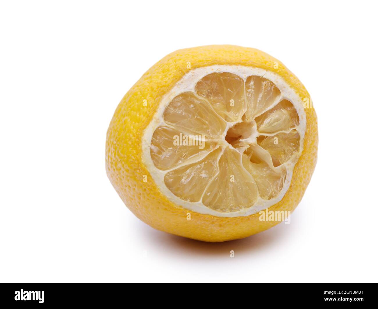 Slice of bad dry lemon isolated over white background Stock Photo - Alamy