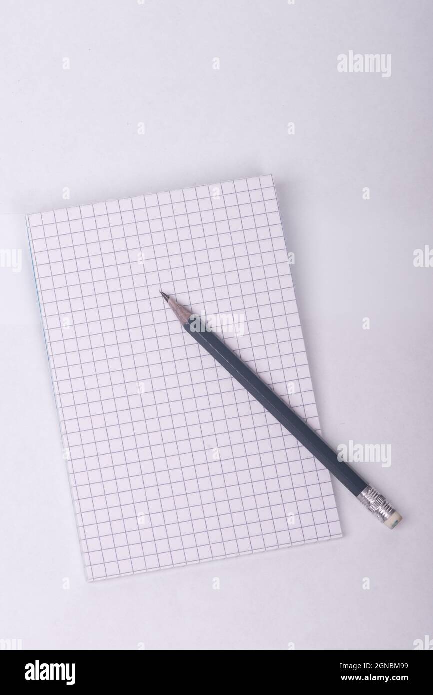 Pencil and open notebook on white background Stock Photo - Alamy