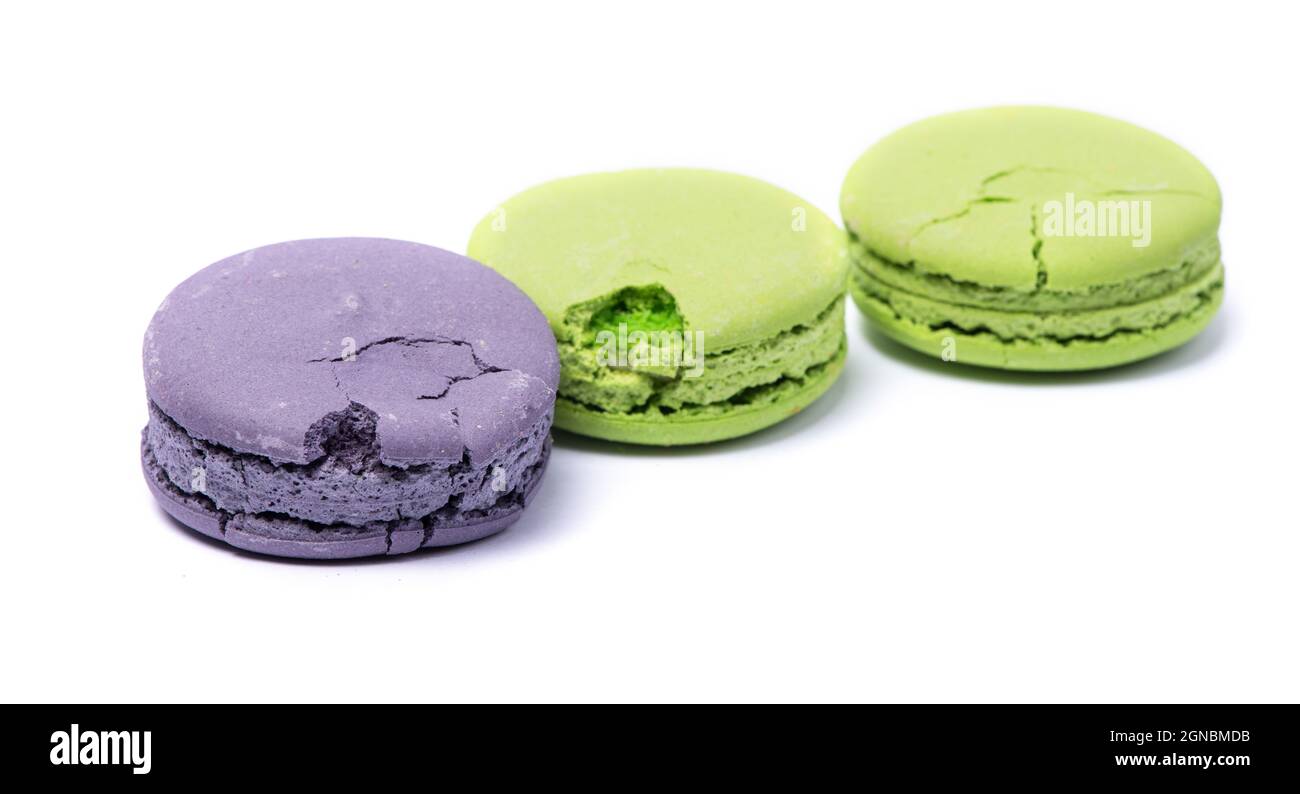 Group of broken macaroons isolated over white background Stock Photo ...