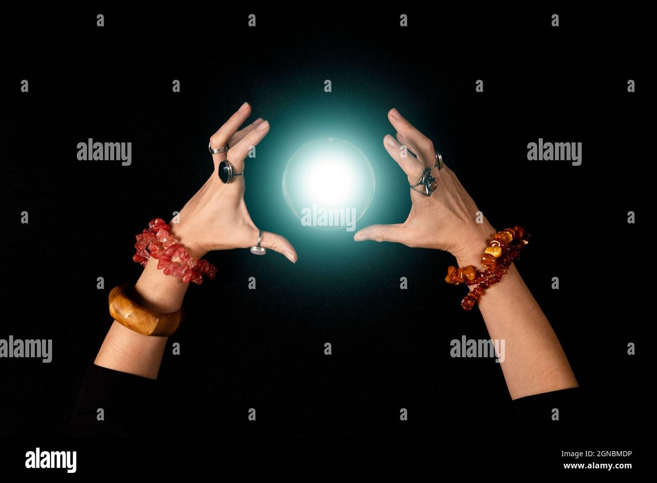 Fortune teller or witch hands and a glowing magic ball. Halloween ...