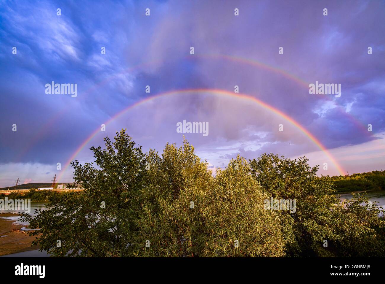 landscape with a double rainbow appeared after the rain Stock Photo - Alamy