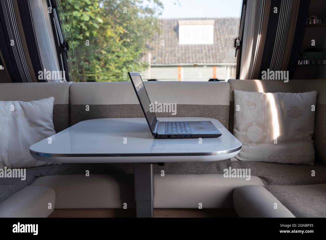 laptop computer ready to internet from inside a caravan Stock Photo - Alamy