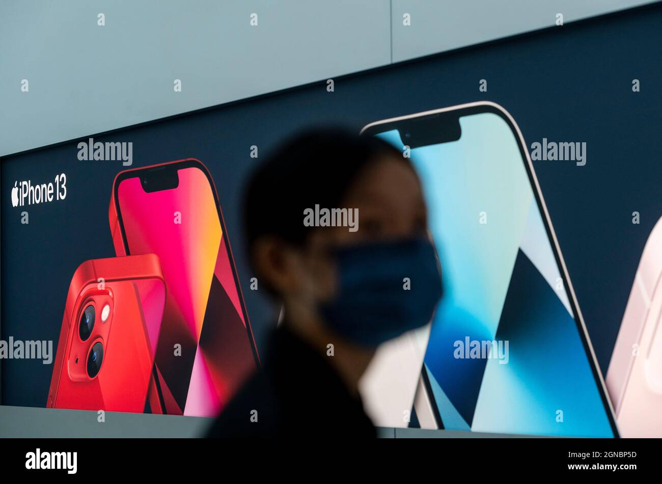 Hong Kong, China. 24th Sep, 2021. An Apple worker stands outside of the ...