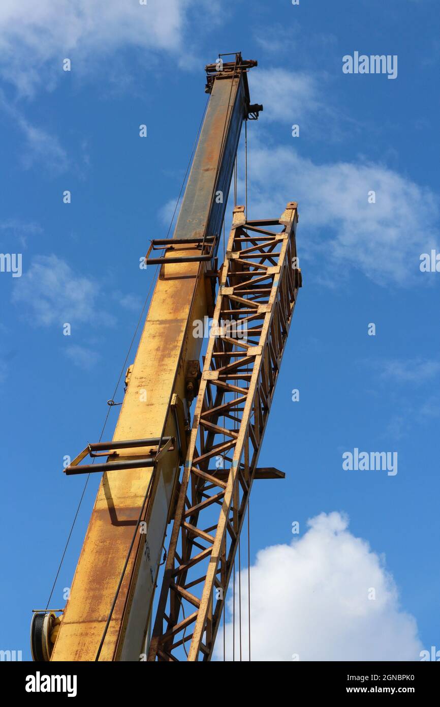 telescopic mast Elevator crane in blue sky low angle view Stock Photo ...