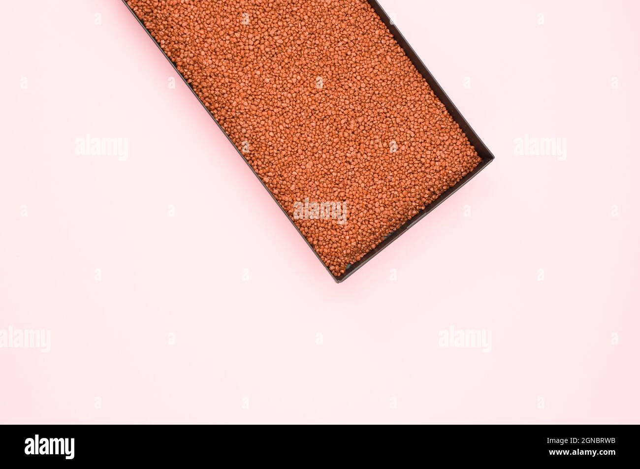 decorative orange colored sand in a metal box Stock Photo - Alamy