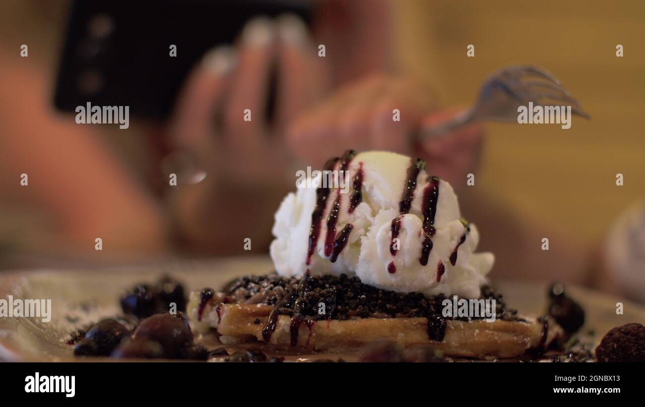 Woman making picture dessert smartphone hi-res stock photography and ...