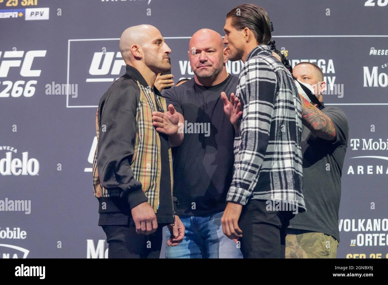 Alexander Volkanovski (left) and Brian Ortega (right) face-off in front ...