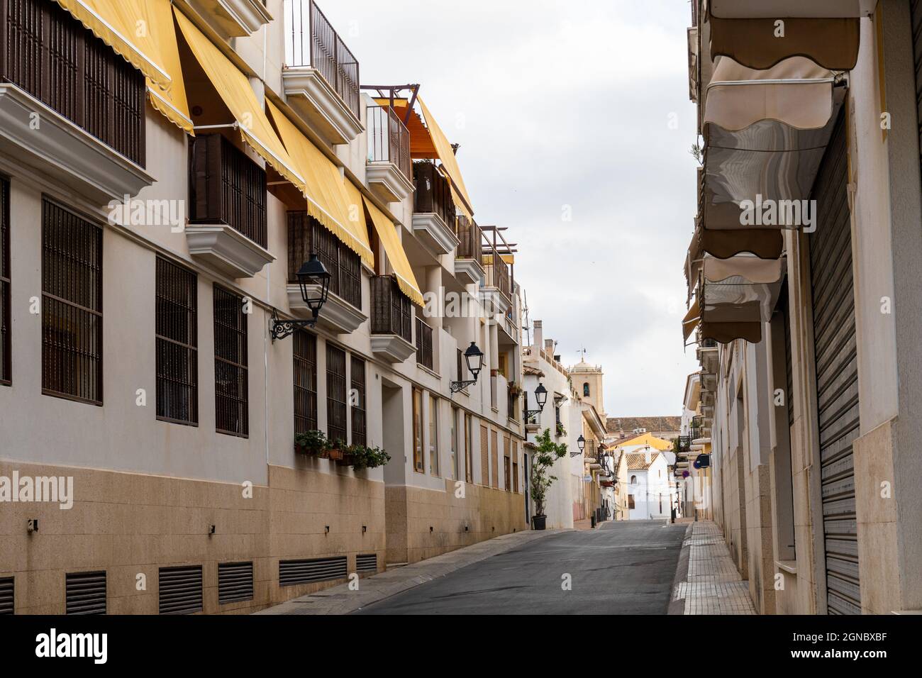 Route surrounded by residential buildings Stock Photo - Alamy