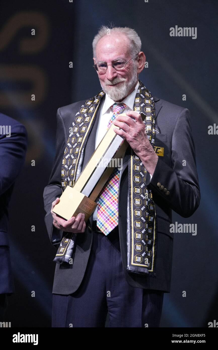 Marc Ratner receives his trophy and his HOF jacket during his induction ...