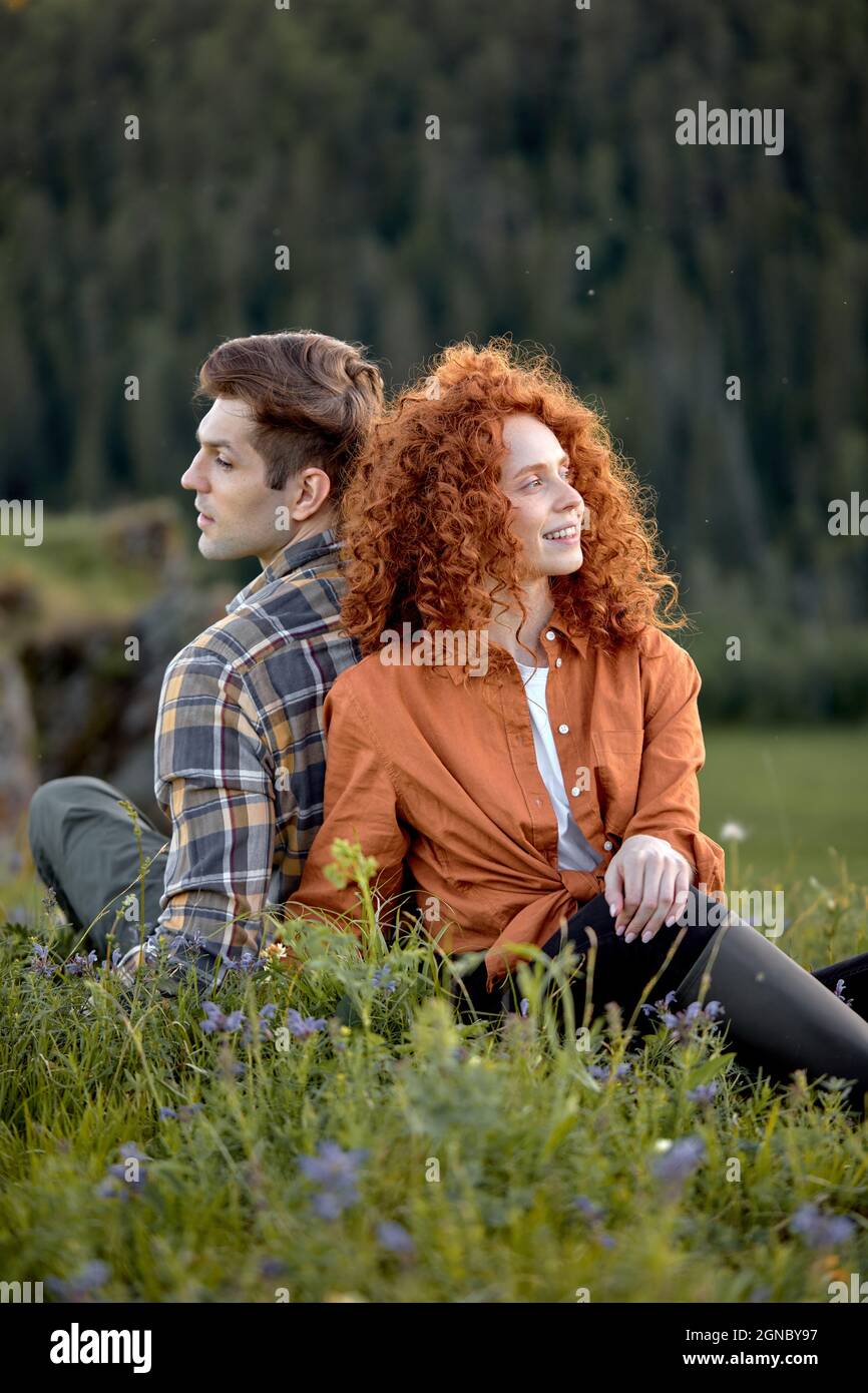 Portrait Of Attractive Young Caucasian Couple Sitting Back To Back To ...