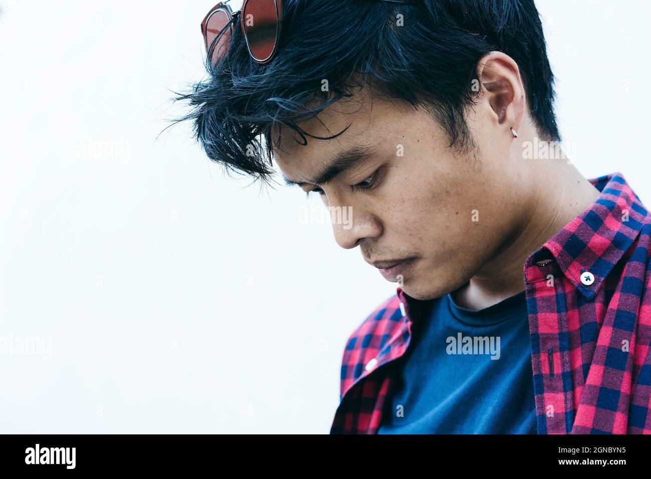 Close up of asian guy - Asian young male looking down while posing for ...