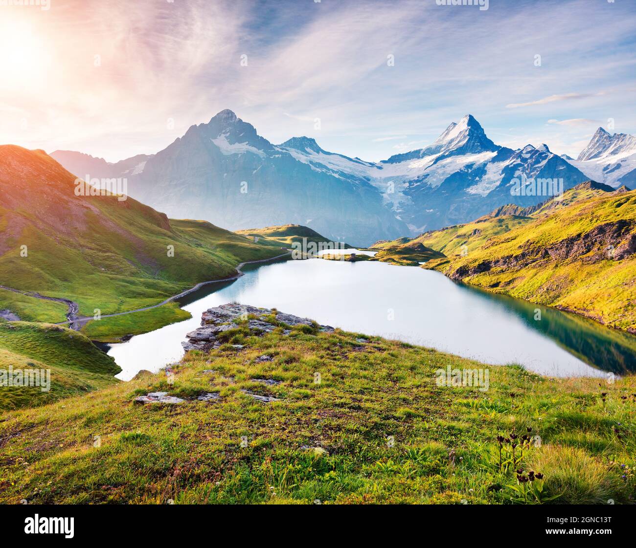 Colorful summer sunrise on Bachalpsee lake with Schreckhorn and ...