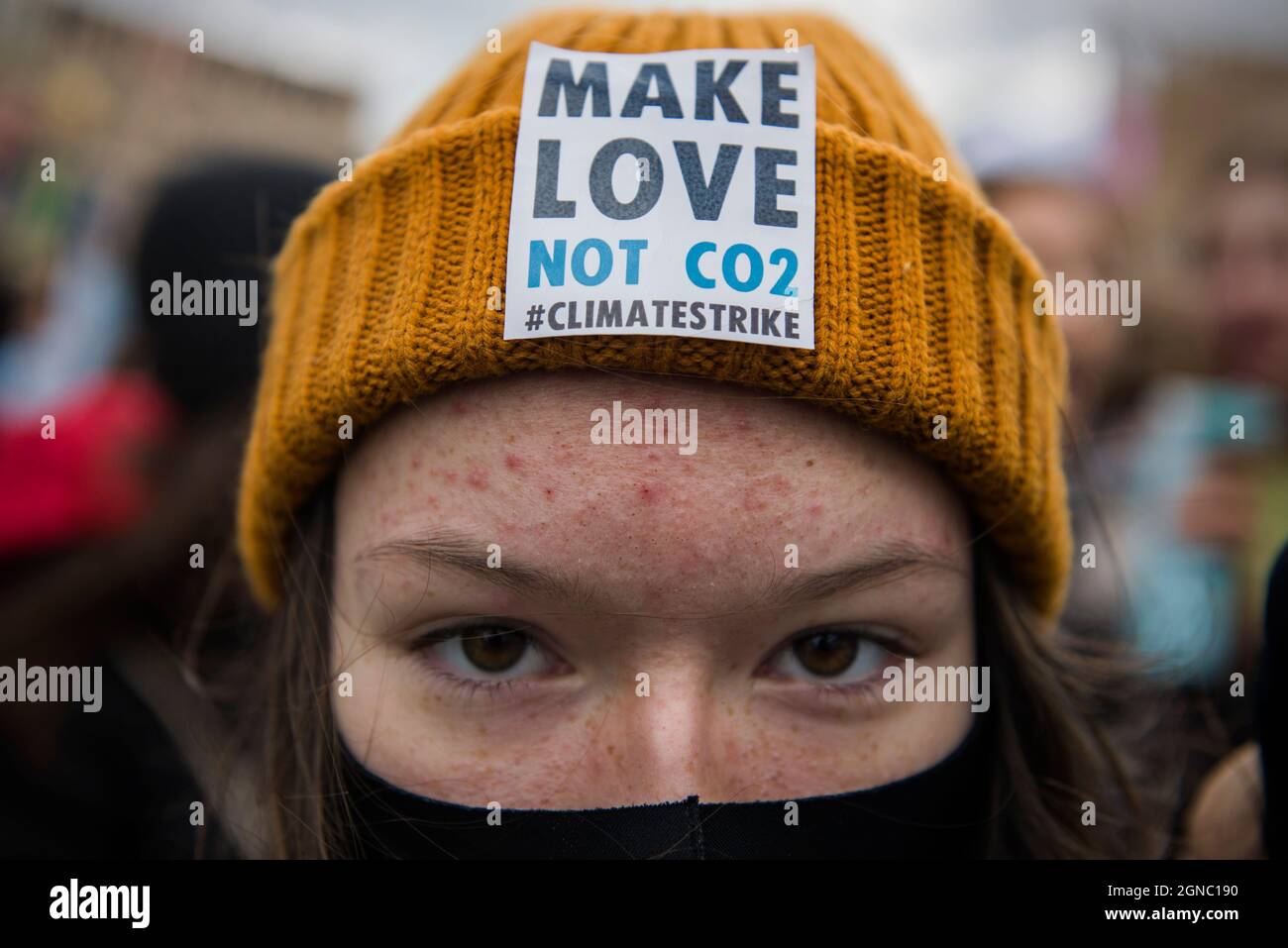 Warsaw, Poland. 24th Sep, 2021. A protester wears a head sock that ...