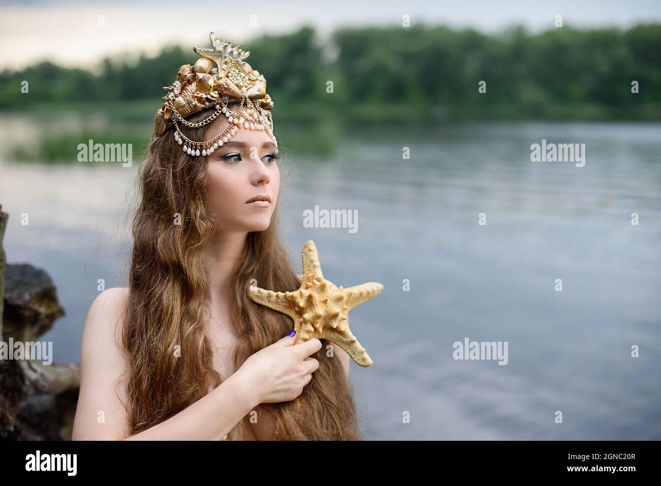 Fantasy woman real mermaid with trident myth goddess of sea with golden ...