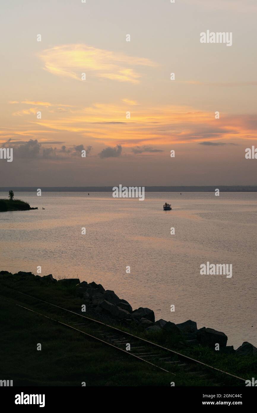 Sea under the sunset sky Stock Photo - Alamy