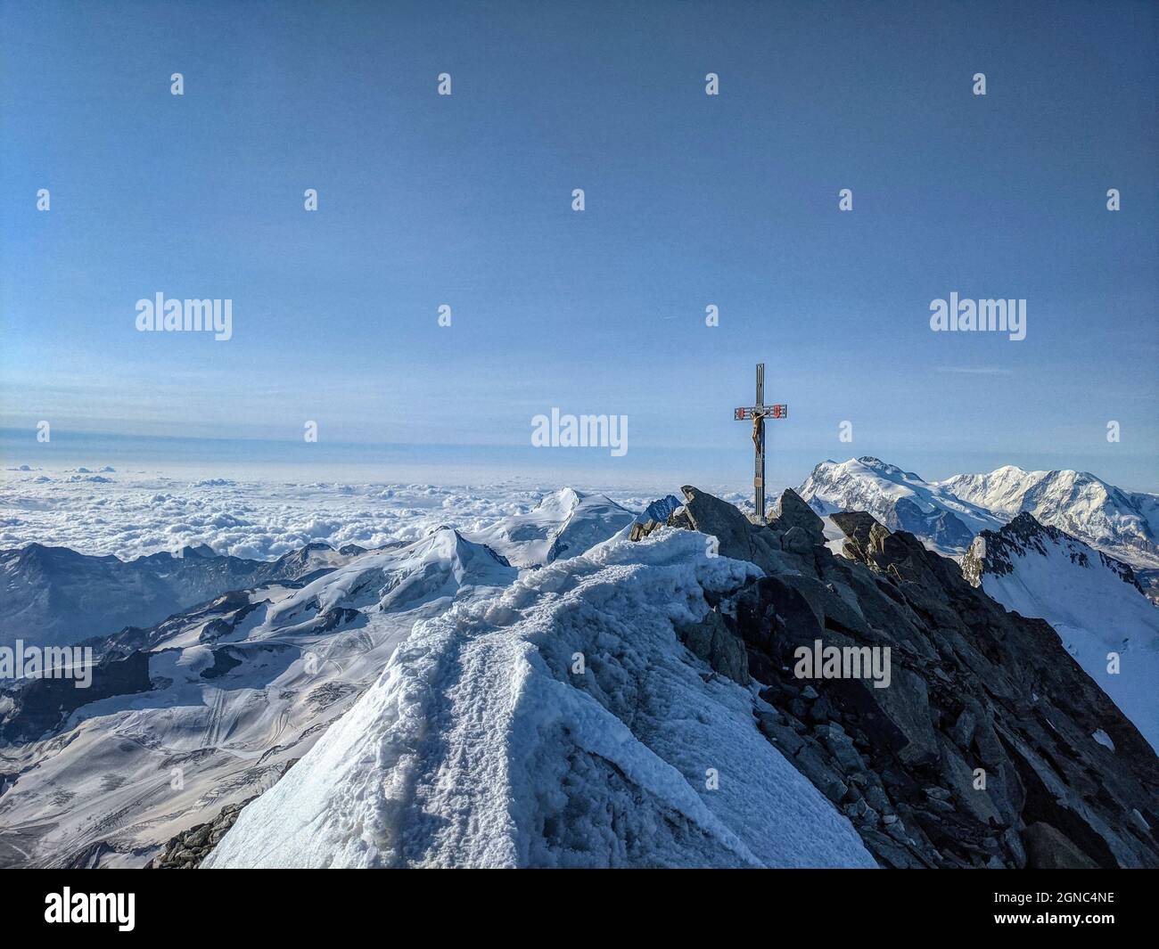 Summit cross on the Dom highest mountain in Switzerland, Mountaineering ...